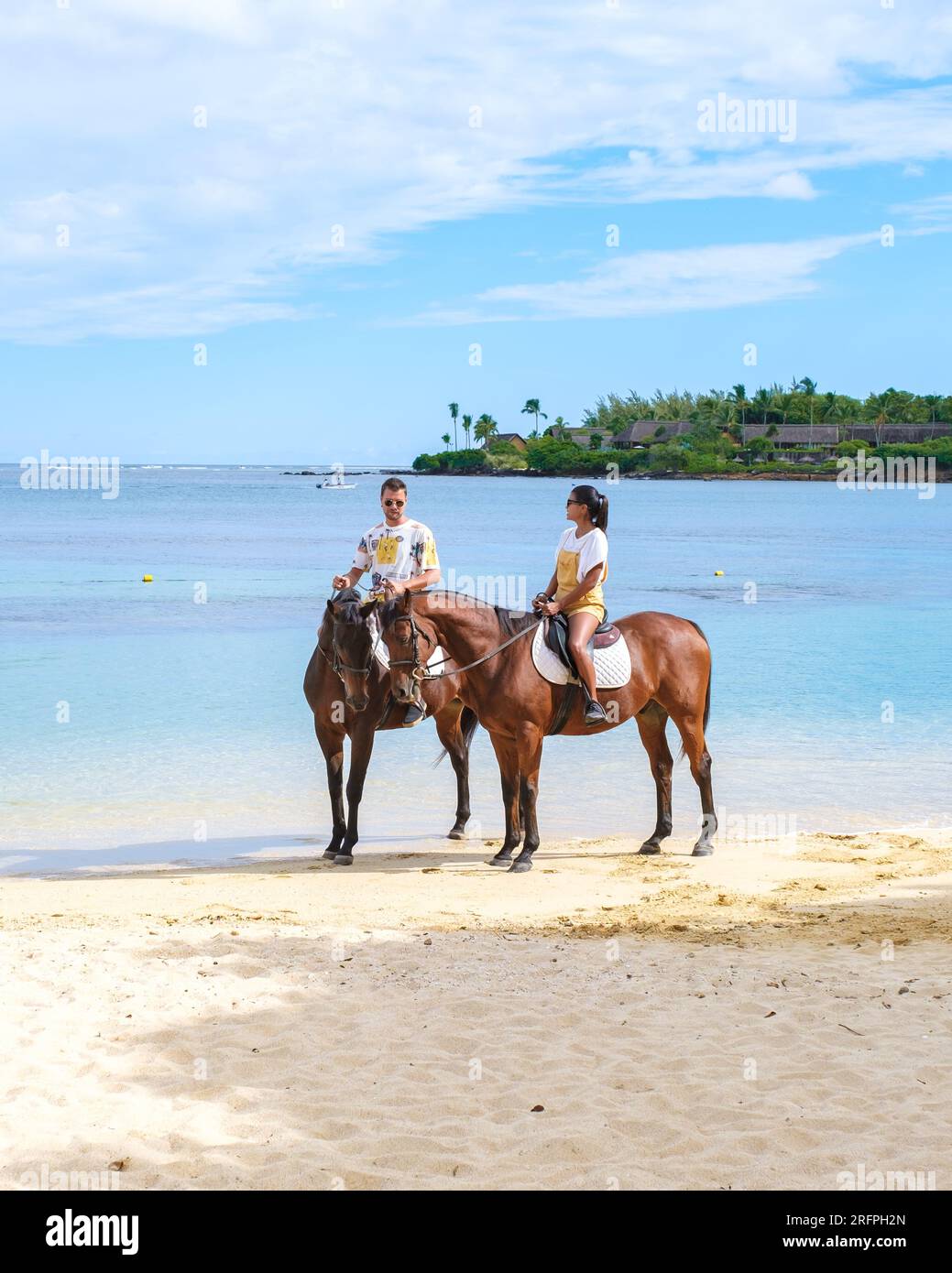 Women riding white horse on beach hi-res stock photography and images ...