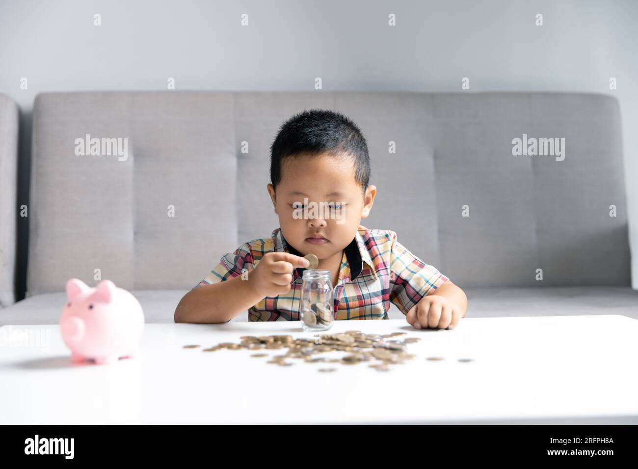 Preschooler child learning to calculate personal budget, manage finance ...