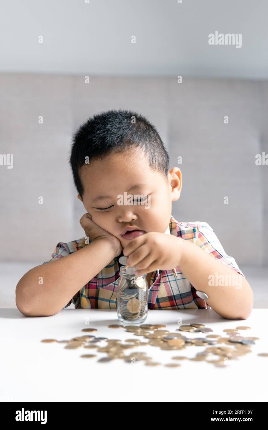 Preschooler child learning to calculate personal budget, manage finance ...