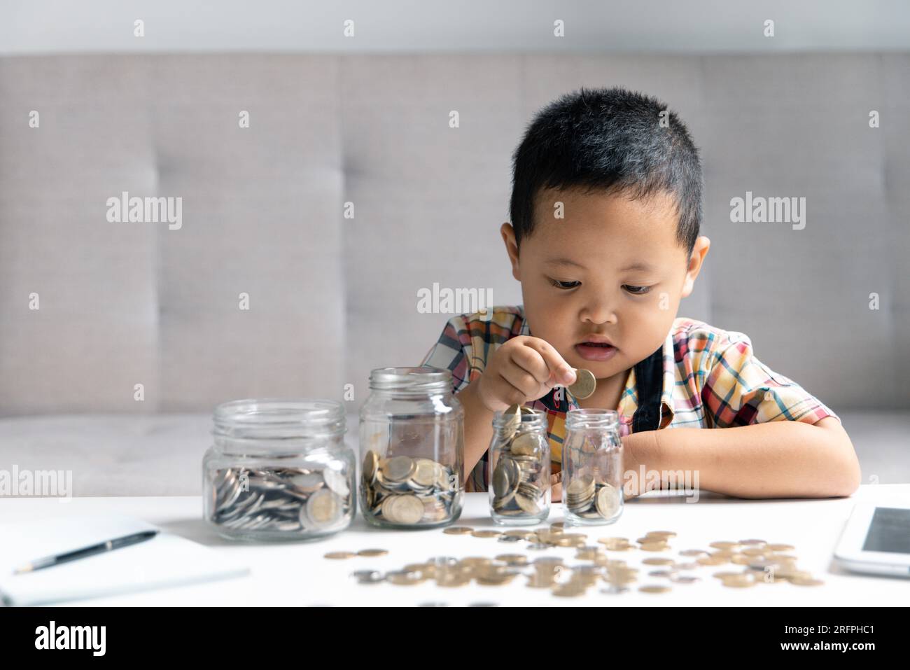 Preschooler child learning to calculate personal budget, manage finance ...