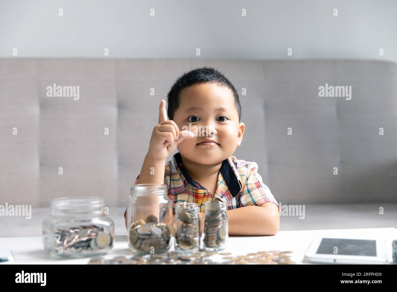 Preschooler child learning to calculate personal budget, manage finance ...