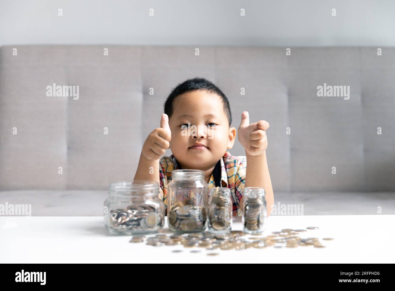 Preschooler child learning to calculate personal budget, manage finance ...