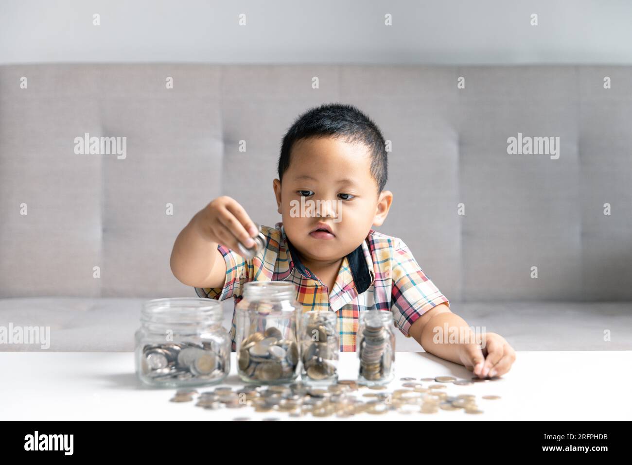 Preschooler child learning to calculate personal budget, manage finance ...