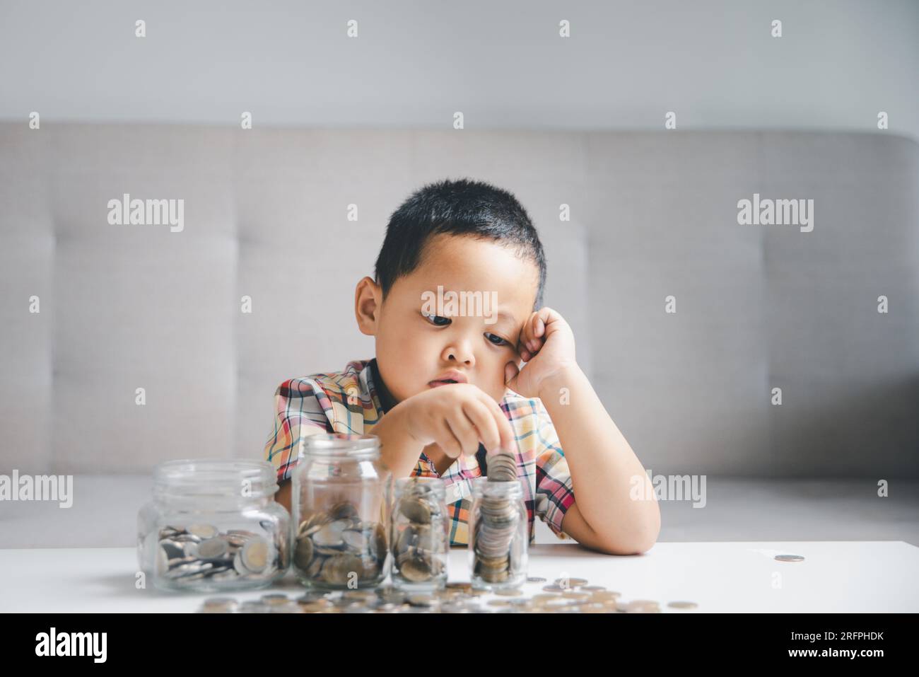 Preschooler child learning to calculate personal budget, manage finance ...