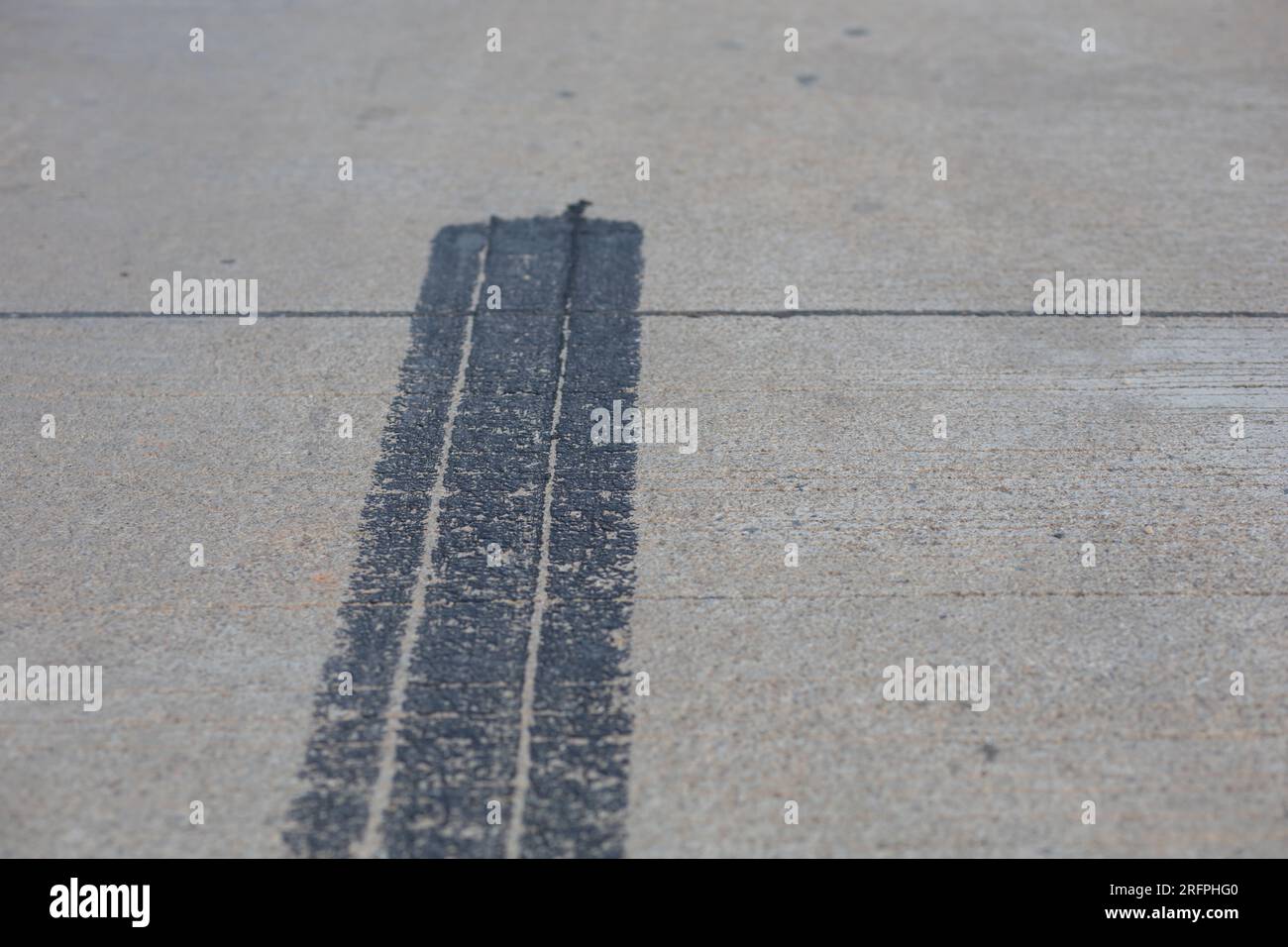 Long road tire brake marks indicate the danger and safety of using the ...