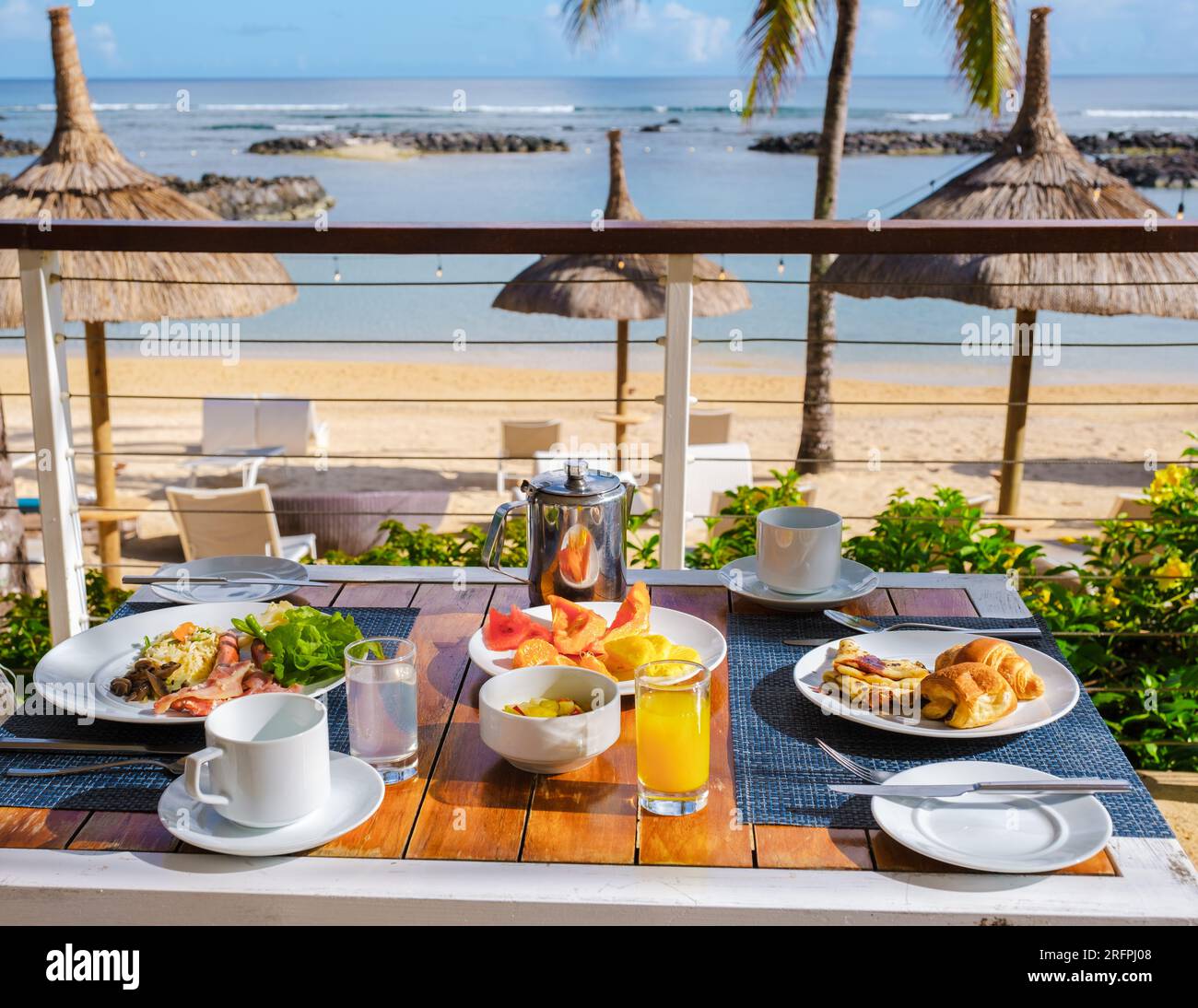 breakfast at a tropical beach in Mauritius, coffee and fruit with ...