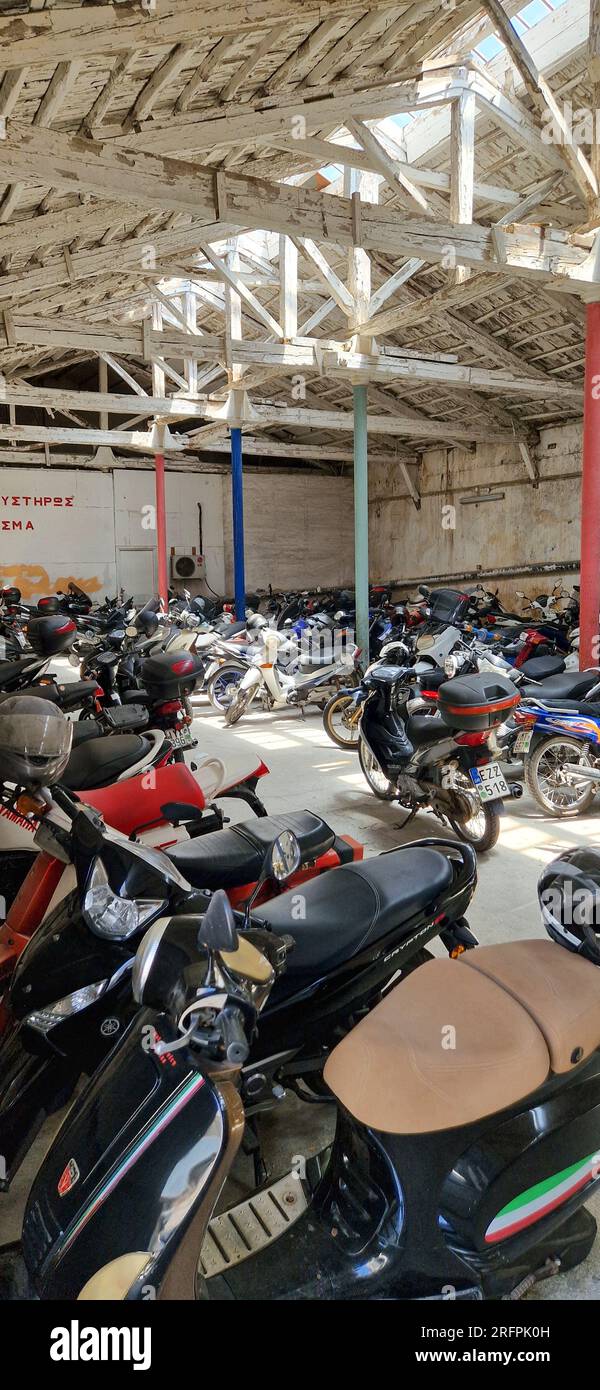 Two wheelers park installed in a old venetian warehouse, Ermopouli ...