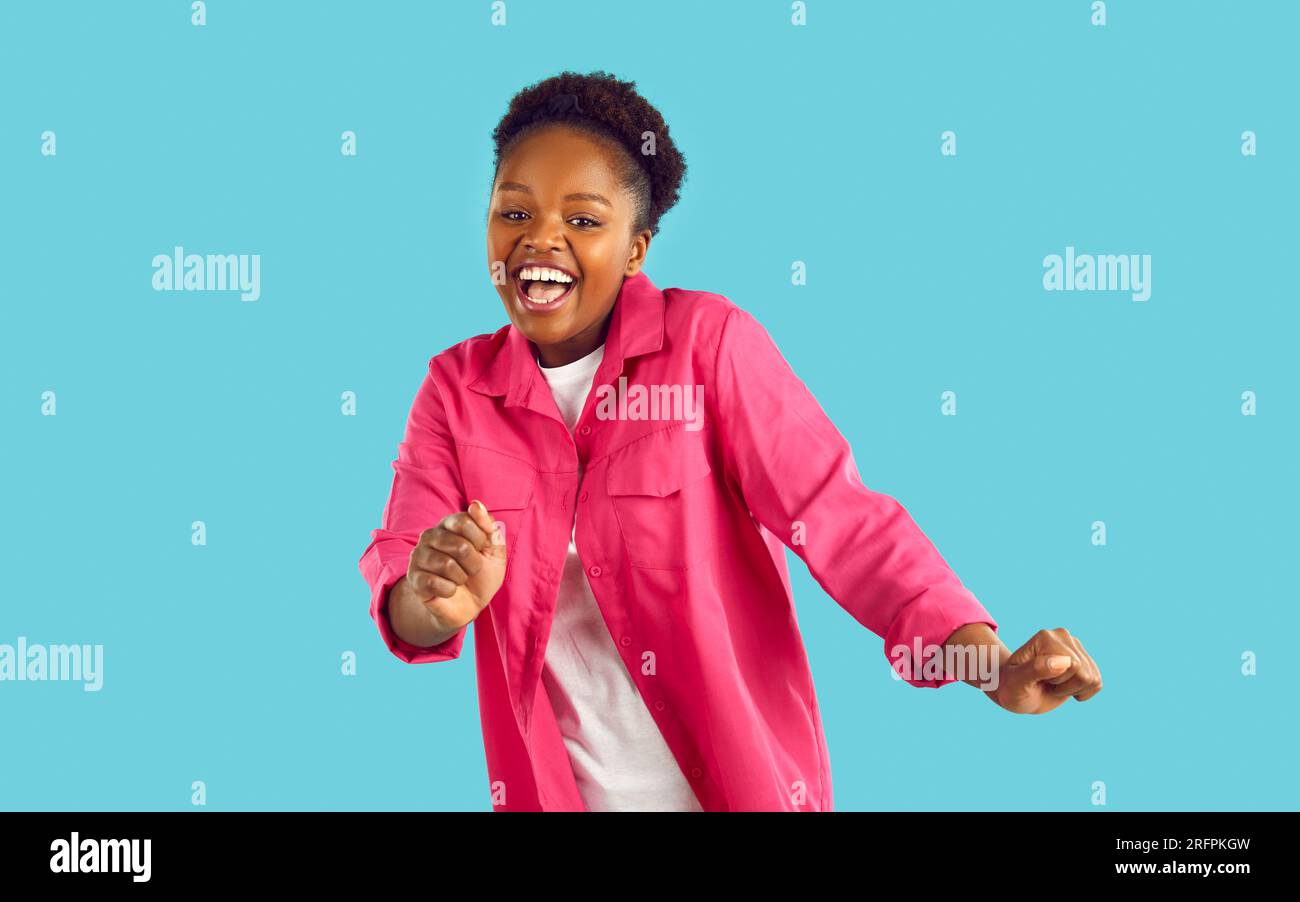 Happy satisfied african american woman dancing feeling euphoric and ...