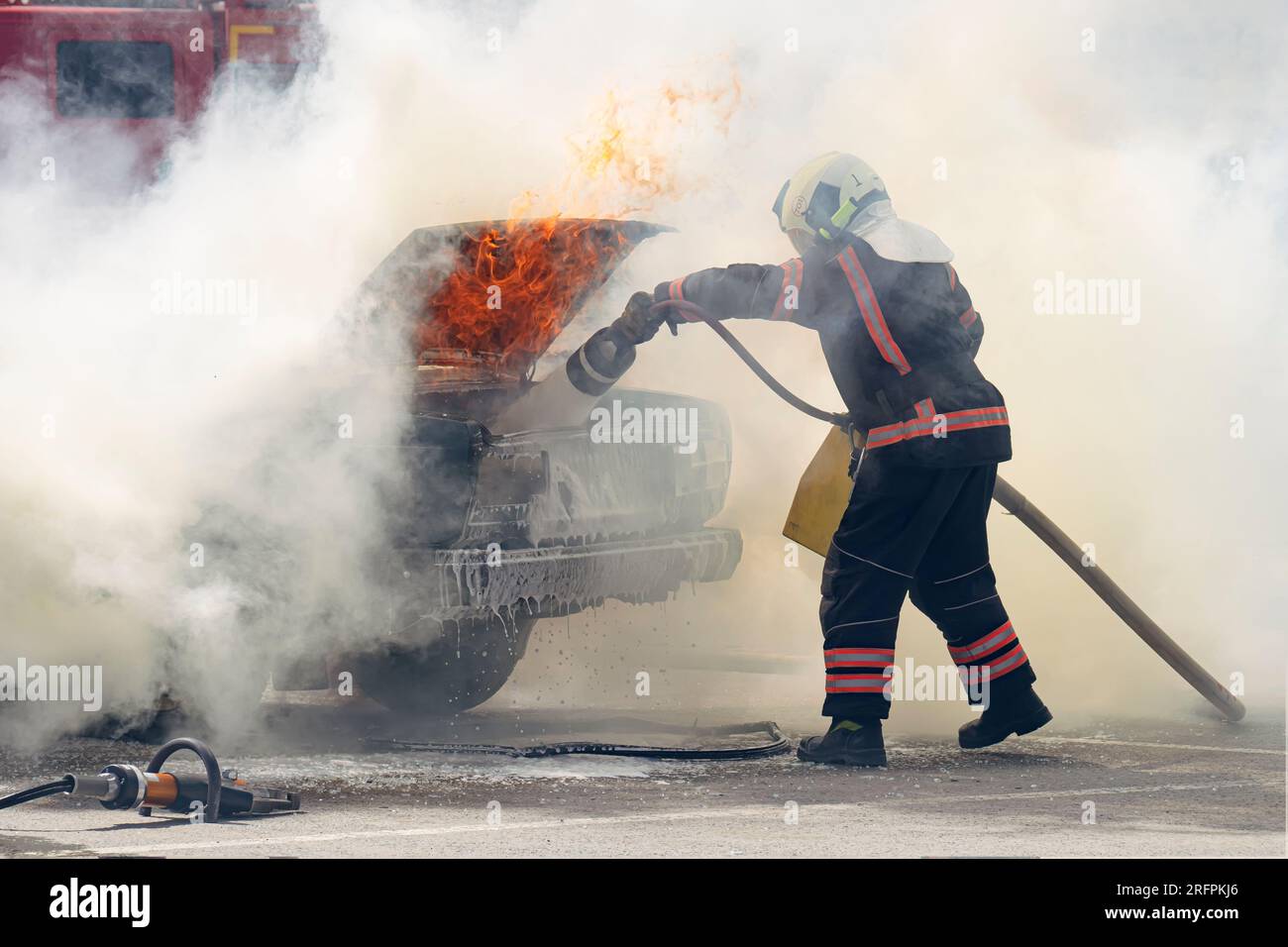 Firefighters attack a propane fire. Fireman Putting Out Fire. Firemen ...