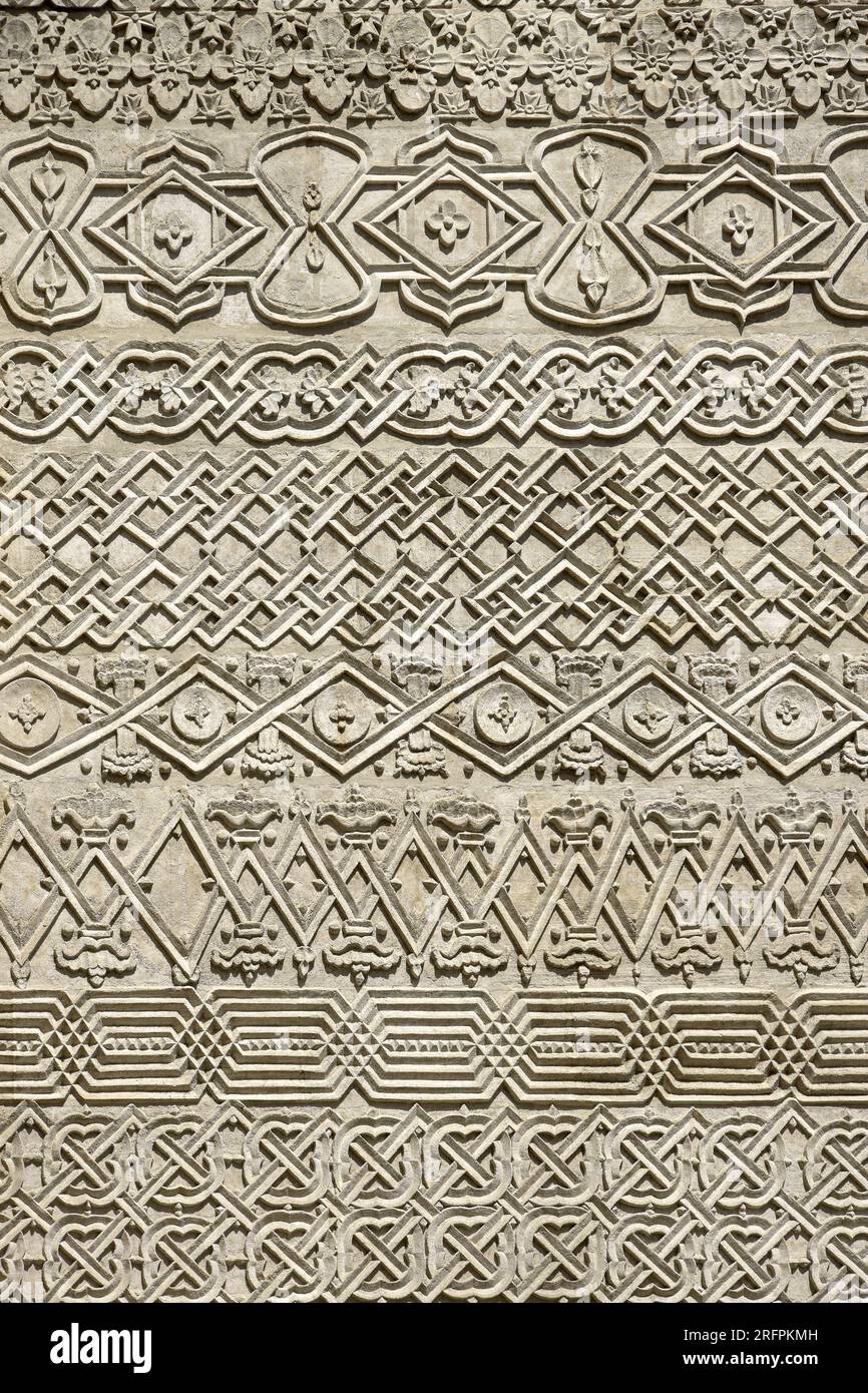 Carved embossed patterns on the stone wall of an ancient church ...