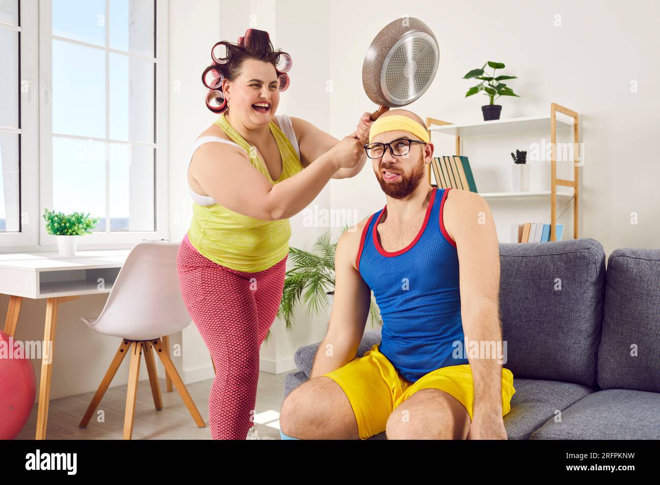 Funny Crazy Housewife Having Fun And Hitting Her Husband On Head With