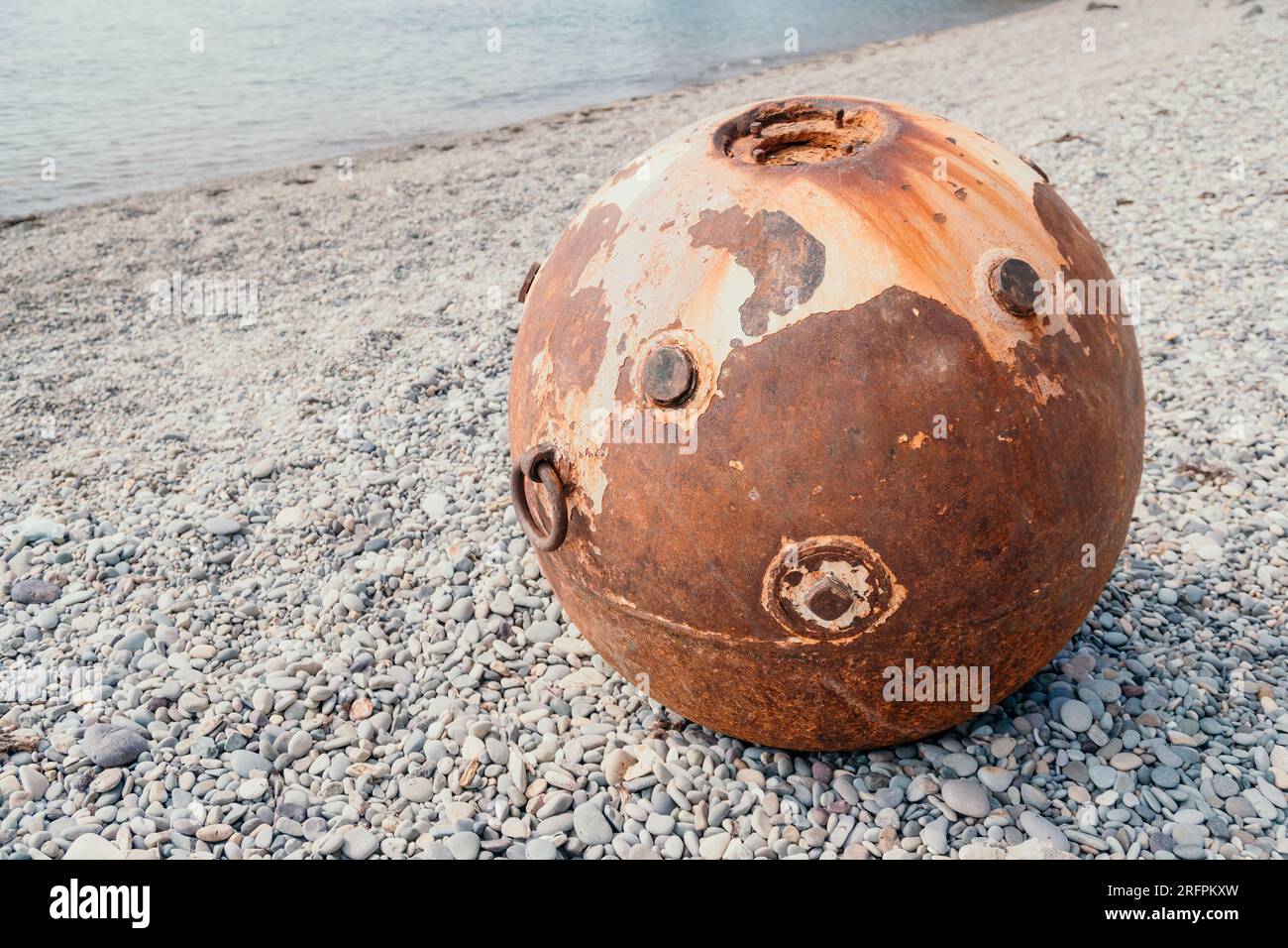 Old rusty sea mine on the beach Stock Photo - Alamy