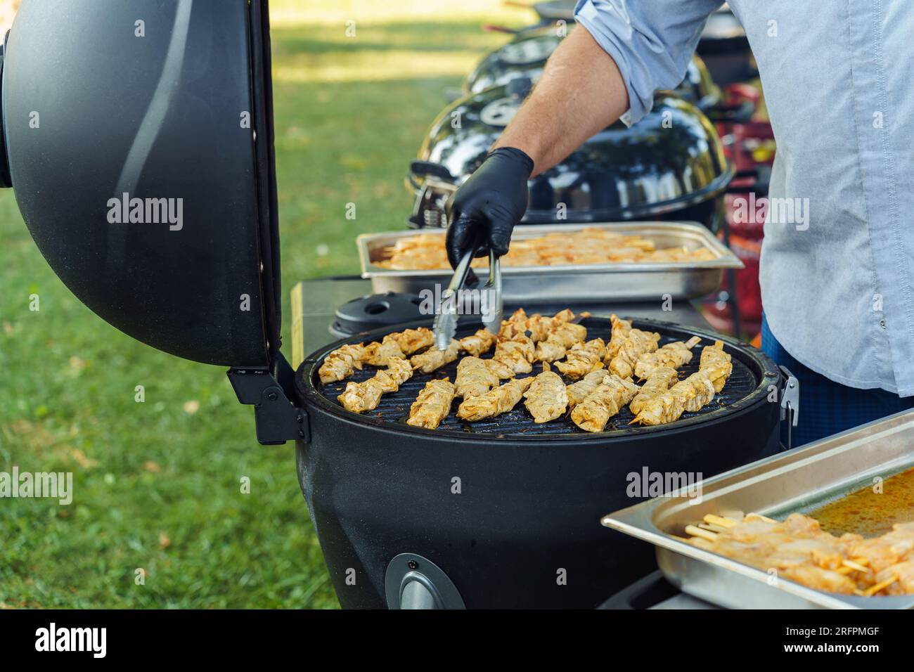 Man cooking chicken skewers kebabs hi-res stock photography and images ...