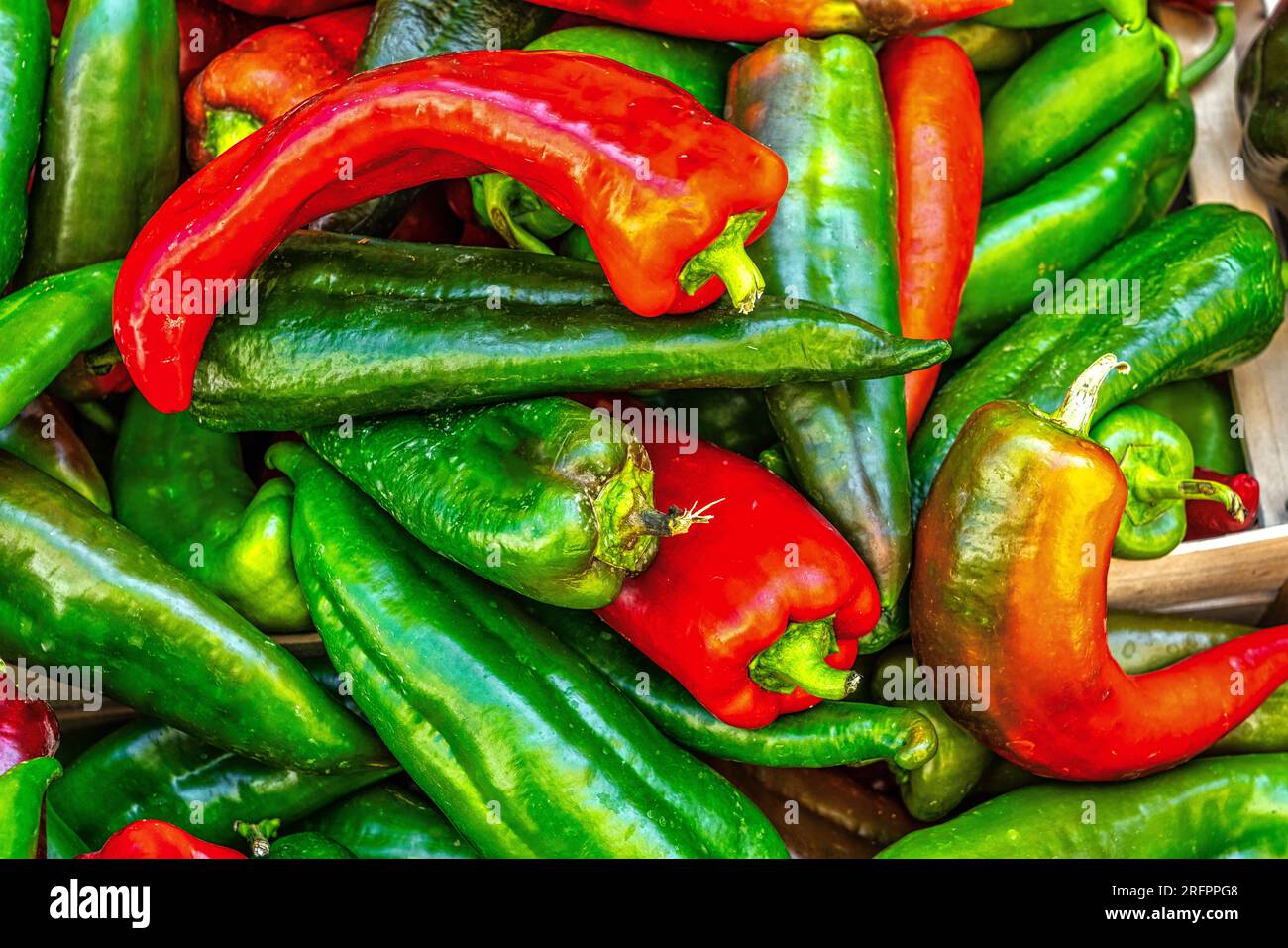 pile of red and green sweet peppers at market Stock Photo - Alamy