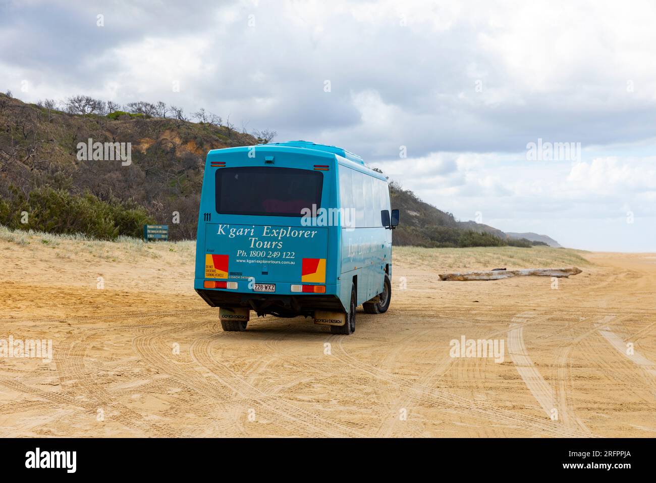Fraser Island K'gari explorer tour bus driving along 75 mile beach ...