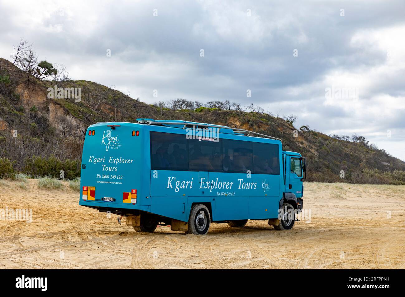 Fraser Island K'gari explorer tour bus driving along 75 mile beach ...