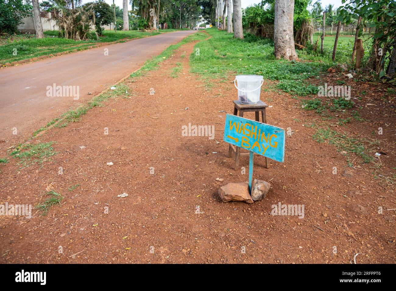Washing Bay: Advertisement for a car wash service on a street in Jinja ...