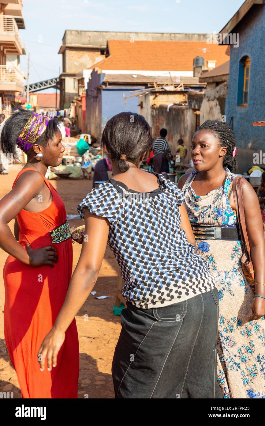 Three women in conversation at the market in Jinja, Uganda Stock Photo ...