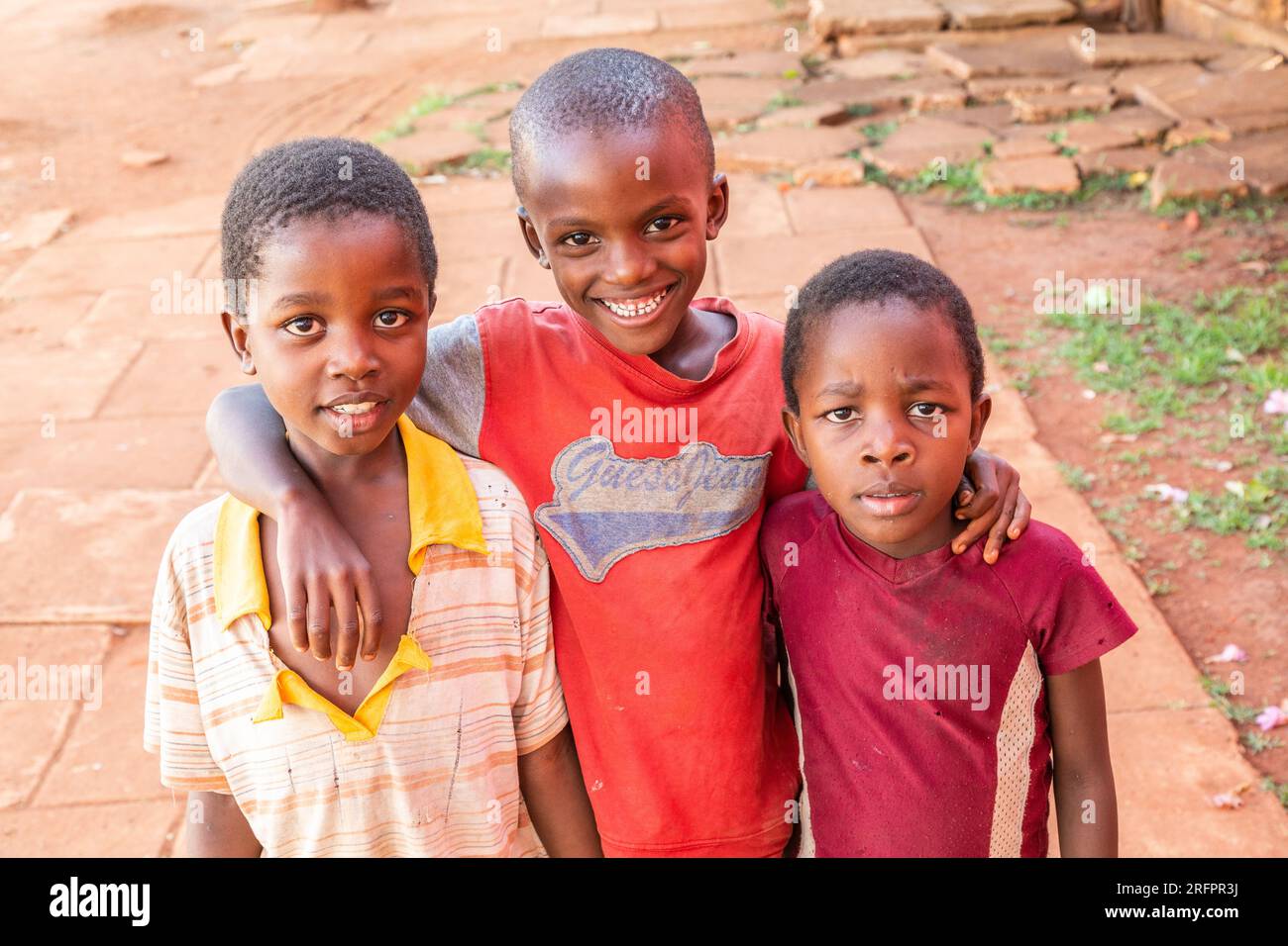 Portrait of three children posing obligingly for the photographer ...