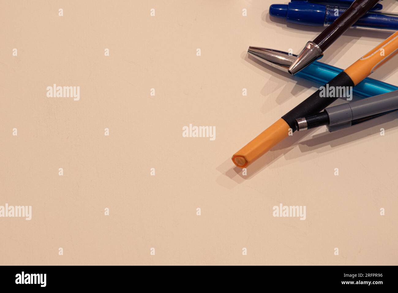 Different pencils isolated on a beige - white background with copyspace ...
