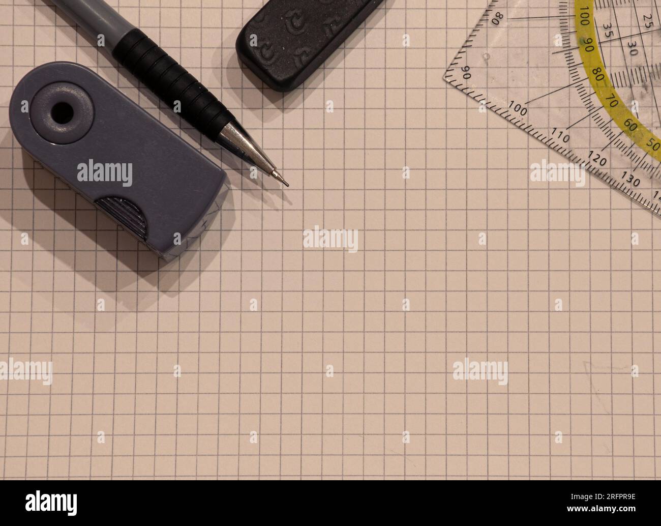 School supplies (pencil, eraser, pencil sharpener and a geometry ...