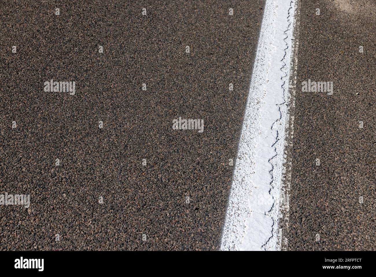 Paved highway with white road markings, traffic regulation using lines ...