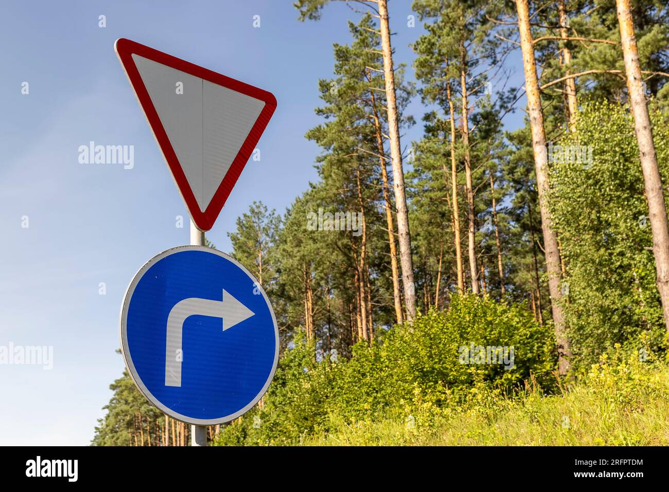A road sign indicating the direction of movement for transport, a ...