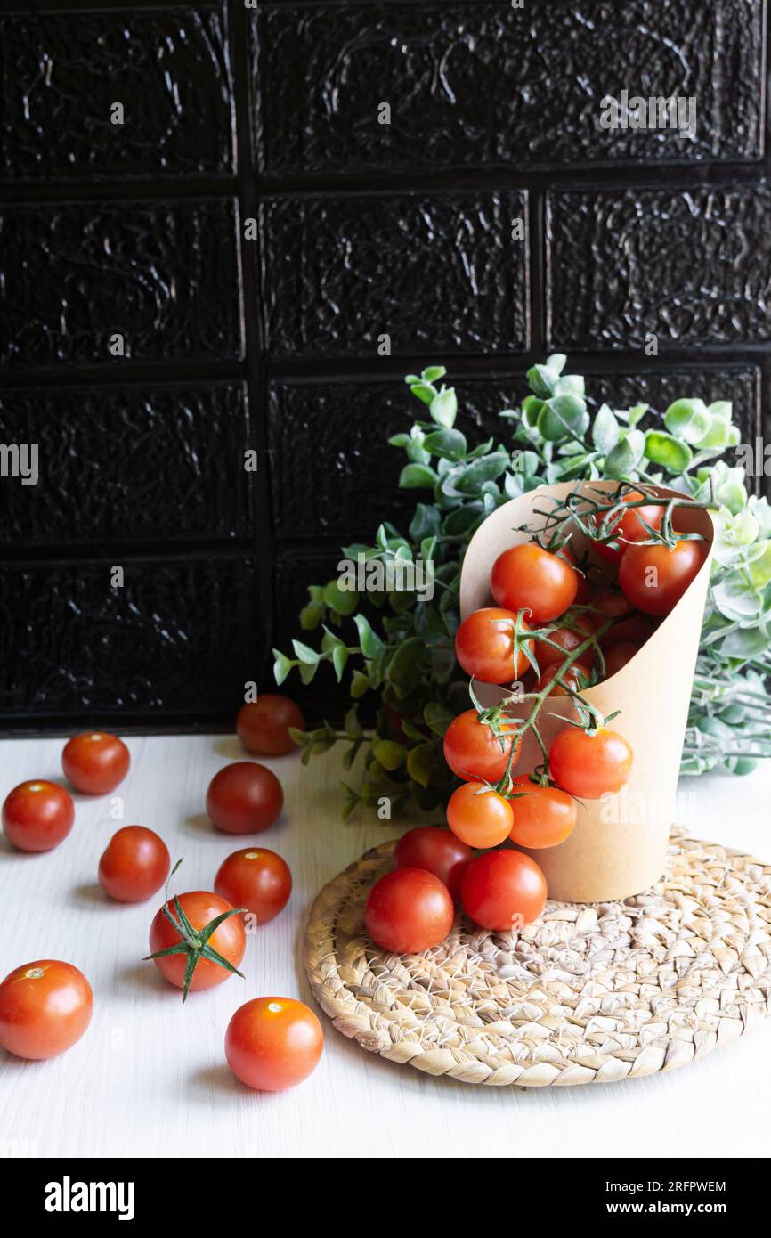 Front view of a cardboard packaging containing cherry tomatoes. Zero ...