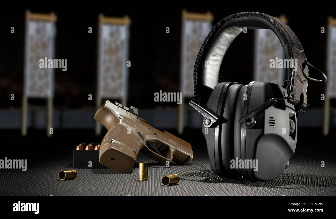 9 mm semi-auto handgun with electronic hearing protection and ammo with ...