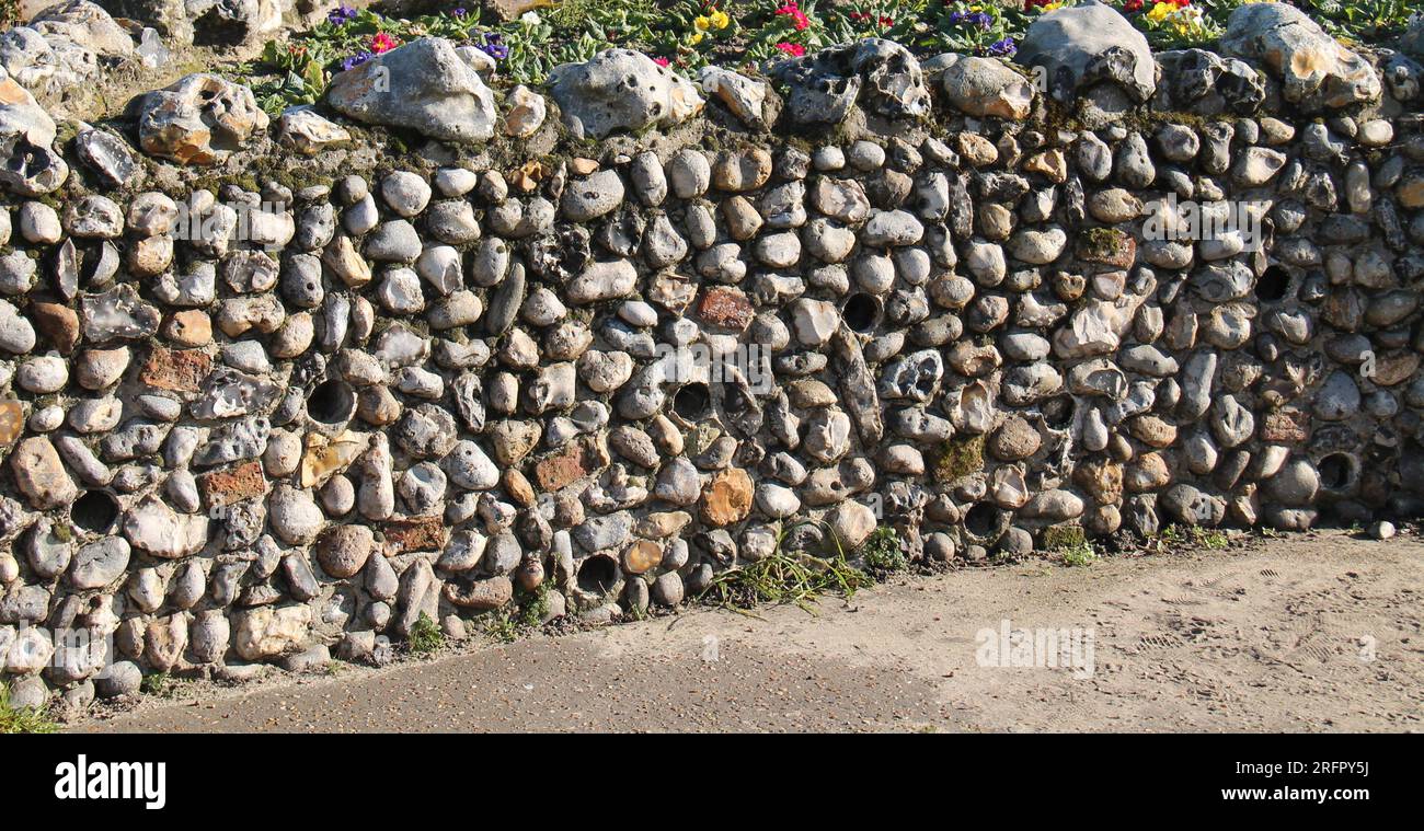 A Flint Stone Boundary Wall with Drainage Holes Stock Photo - Alamy
