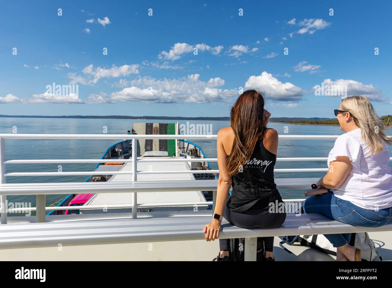 Ferry to Fraser Island female friends enjoy views of the coral sea and ...