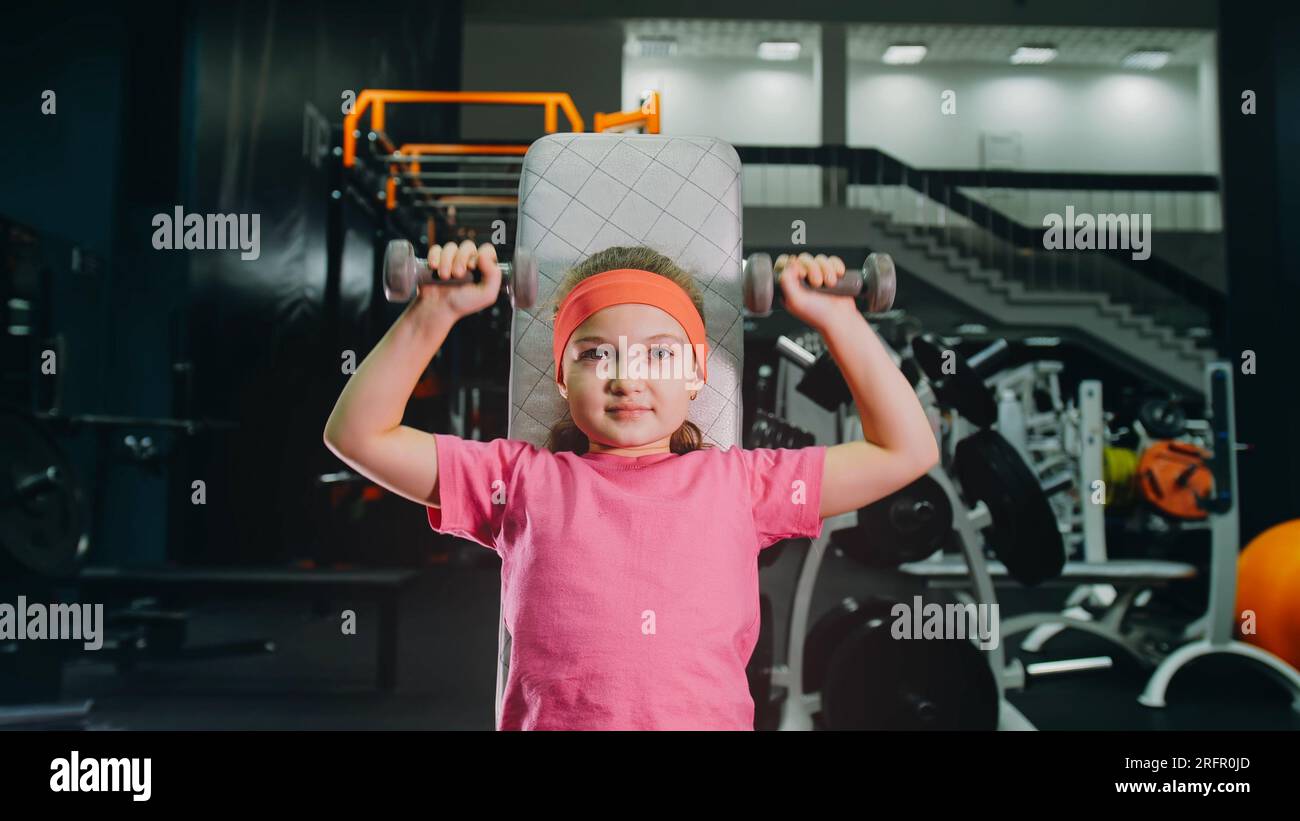 Fit Athletic Baby Girl Work out with Dumbbell, Doing Her Fitness ...