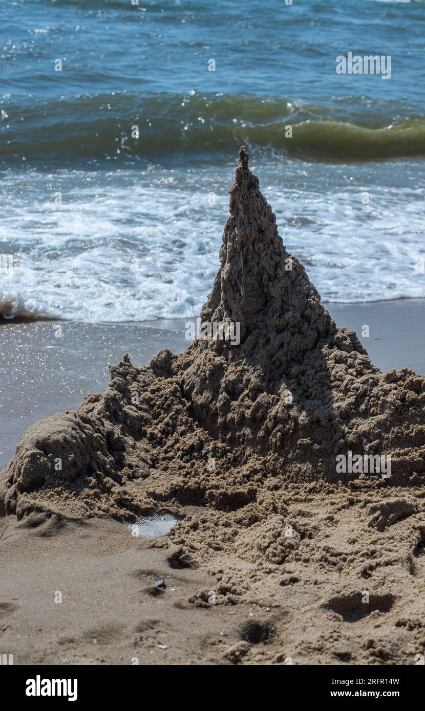 sand castle on the beach near the water. High quality photo Stock Photo ...
