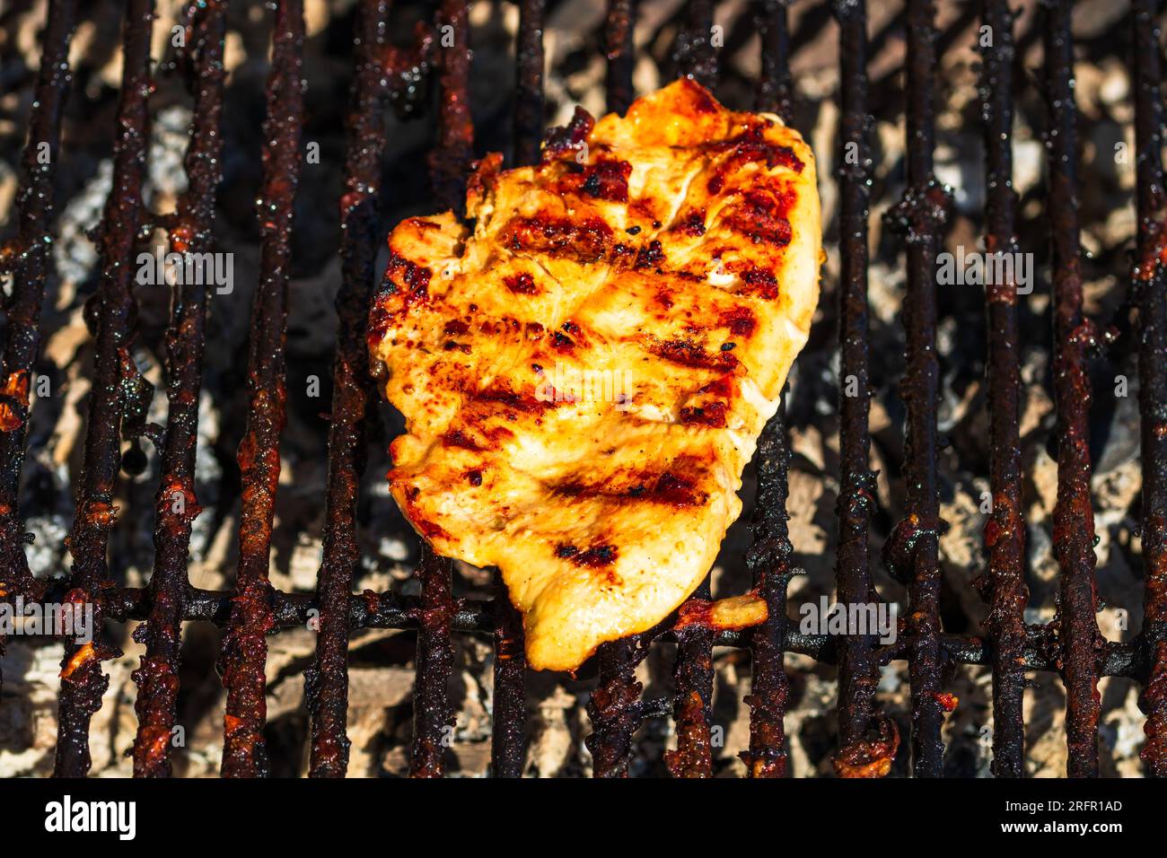 Steak grilled on a charcoal barbeque. Top view of camping tasty ...