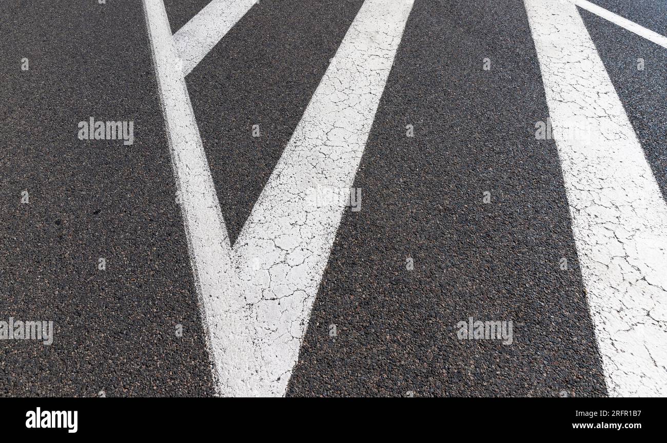 Paved highway with white road markings, traffic regulation using lines ...