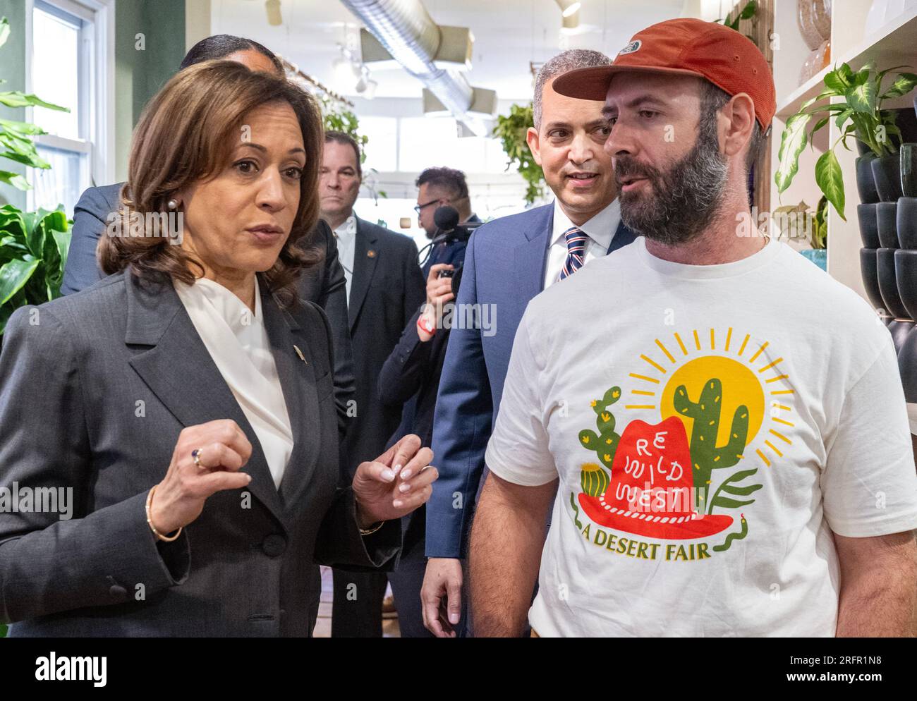 United States Vice President Kamala Harris, left, shops for a plant at ...