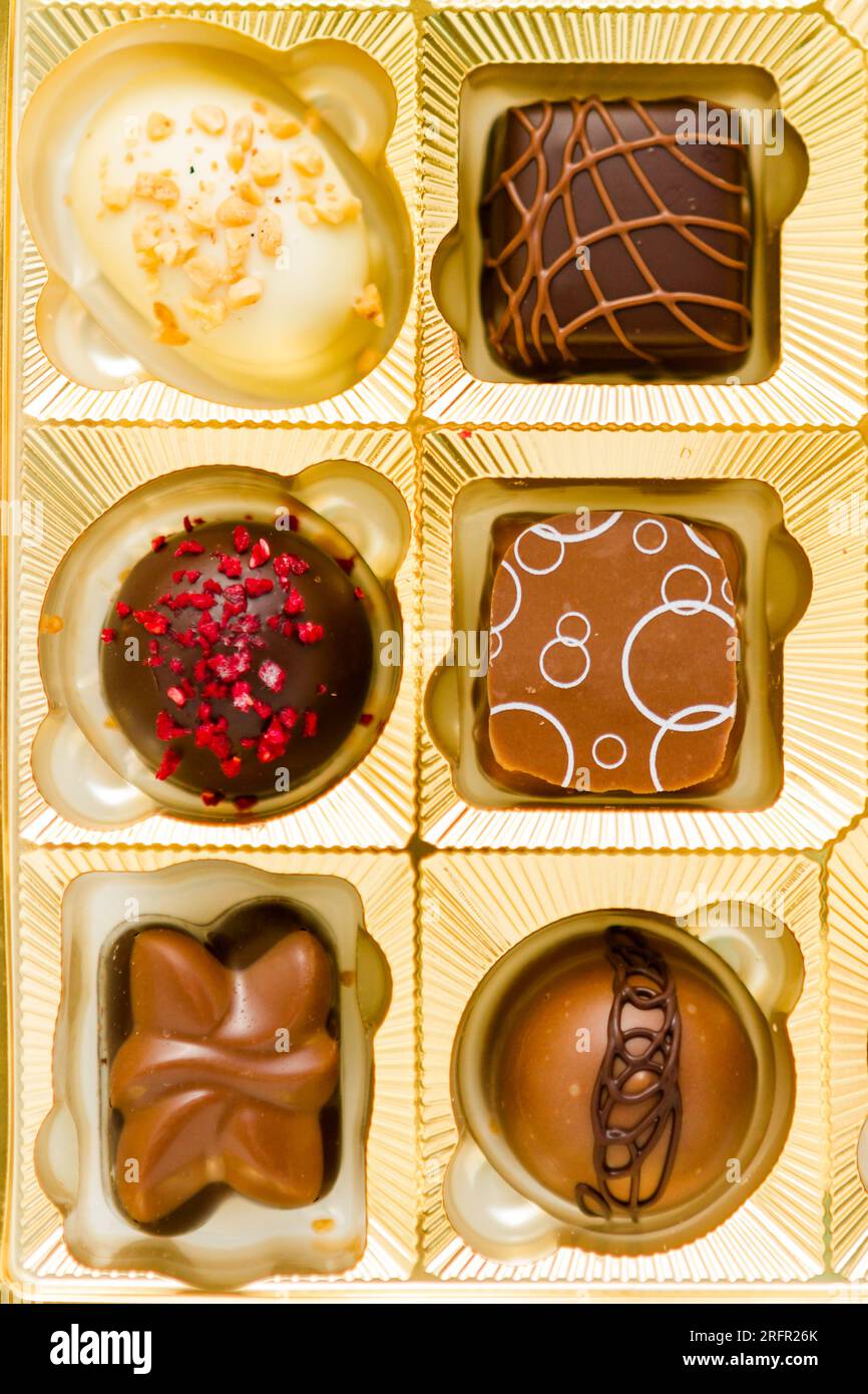 Small chocolate wrapped in gold hi-res stock photography and images - Alamy