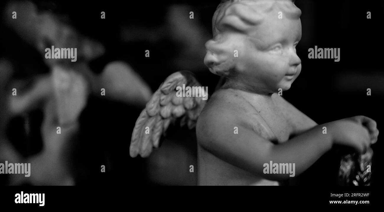 delicate winged marble cherub Stock Photo - Alamy