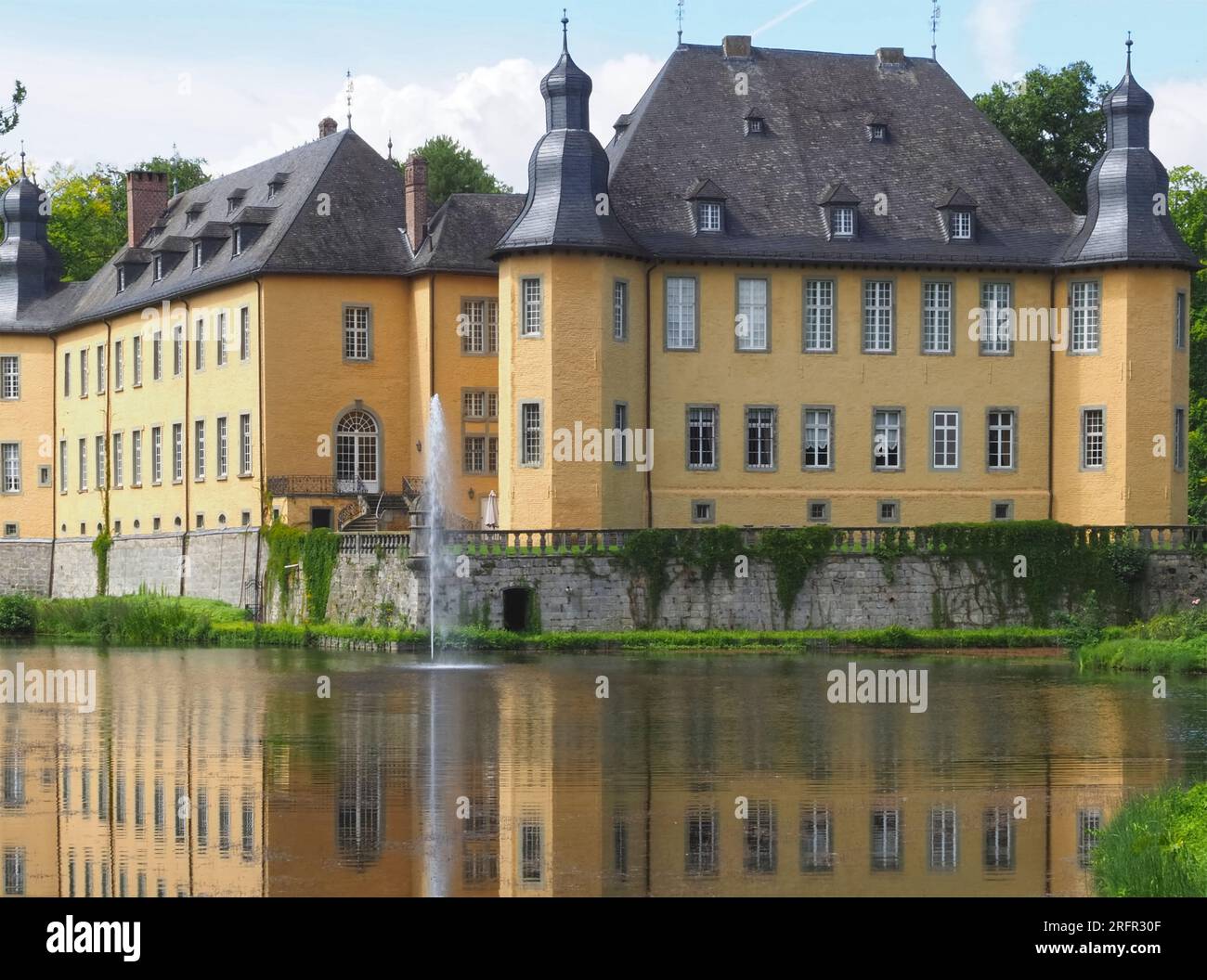 Beautiful german yellow water castle Schloss Dyck Stock Photo - Alamy