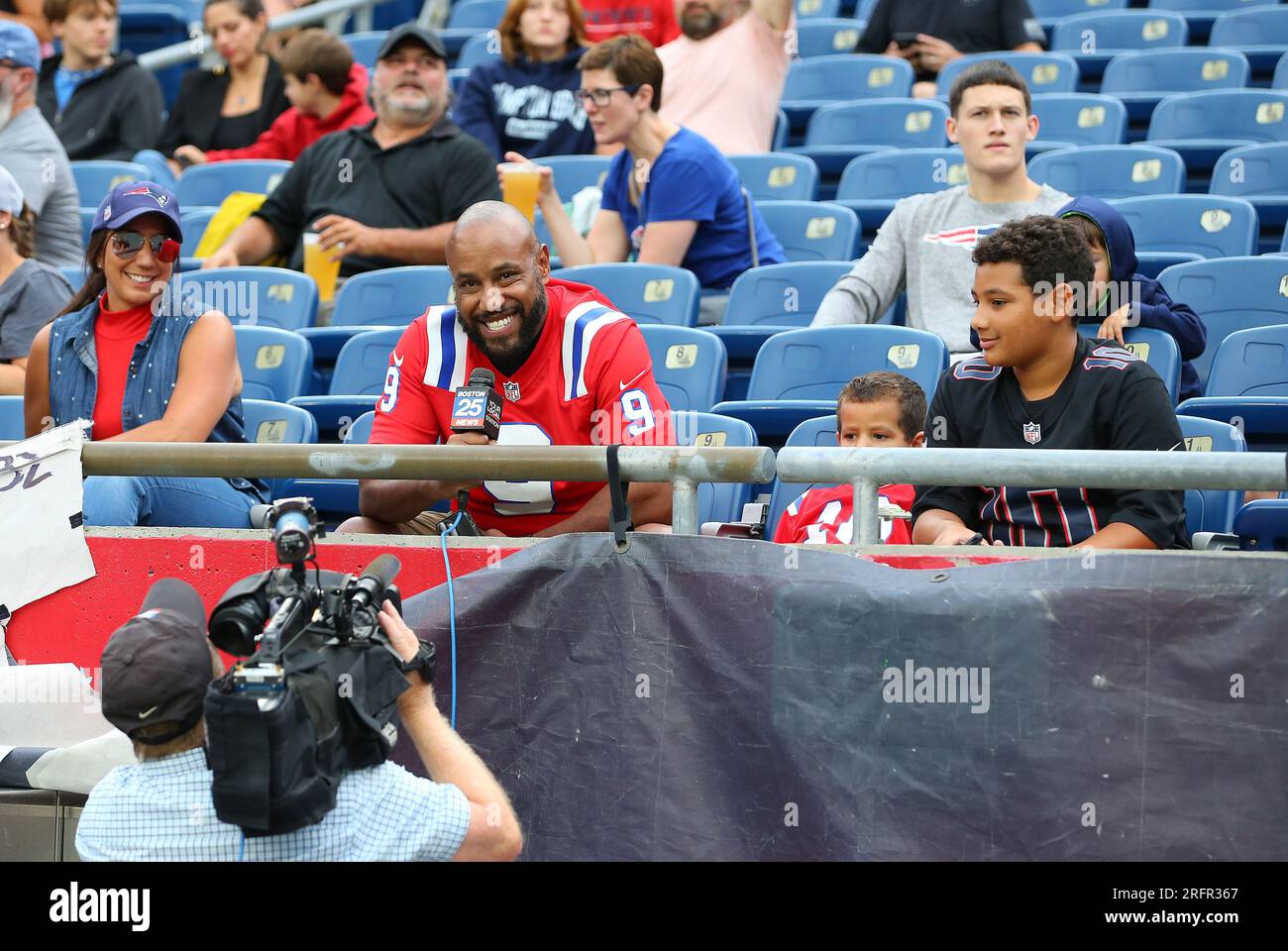 August 4, 2023; Foxborough, MA, USA; A fan is interviewed during ...