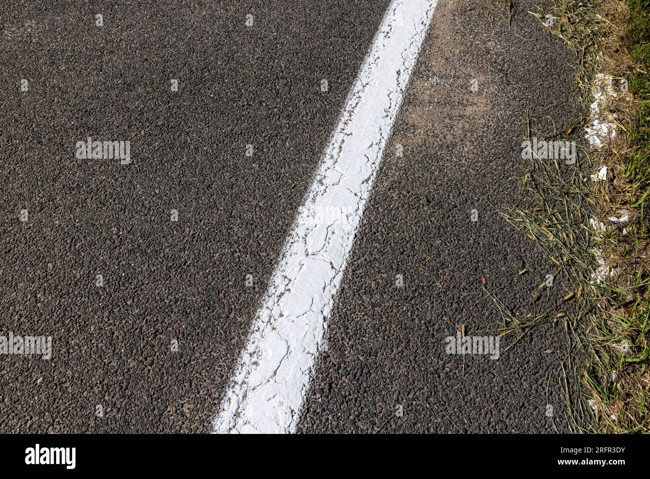 Paved highway with white road markings, traffic regulation using lines ...
