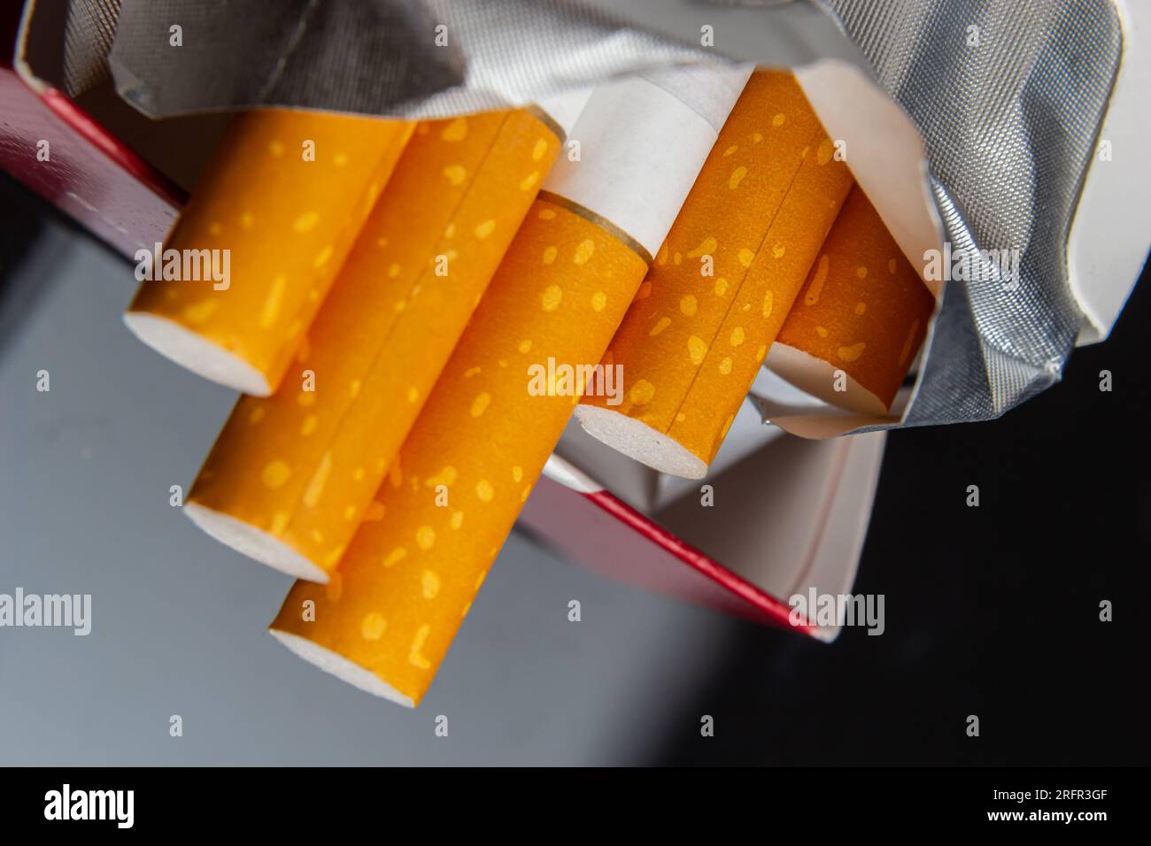 Close up cigarette in pack is addictive to be cancer.smoking reduction ...