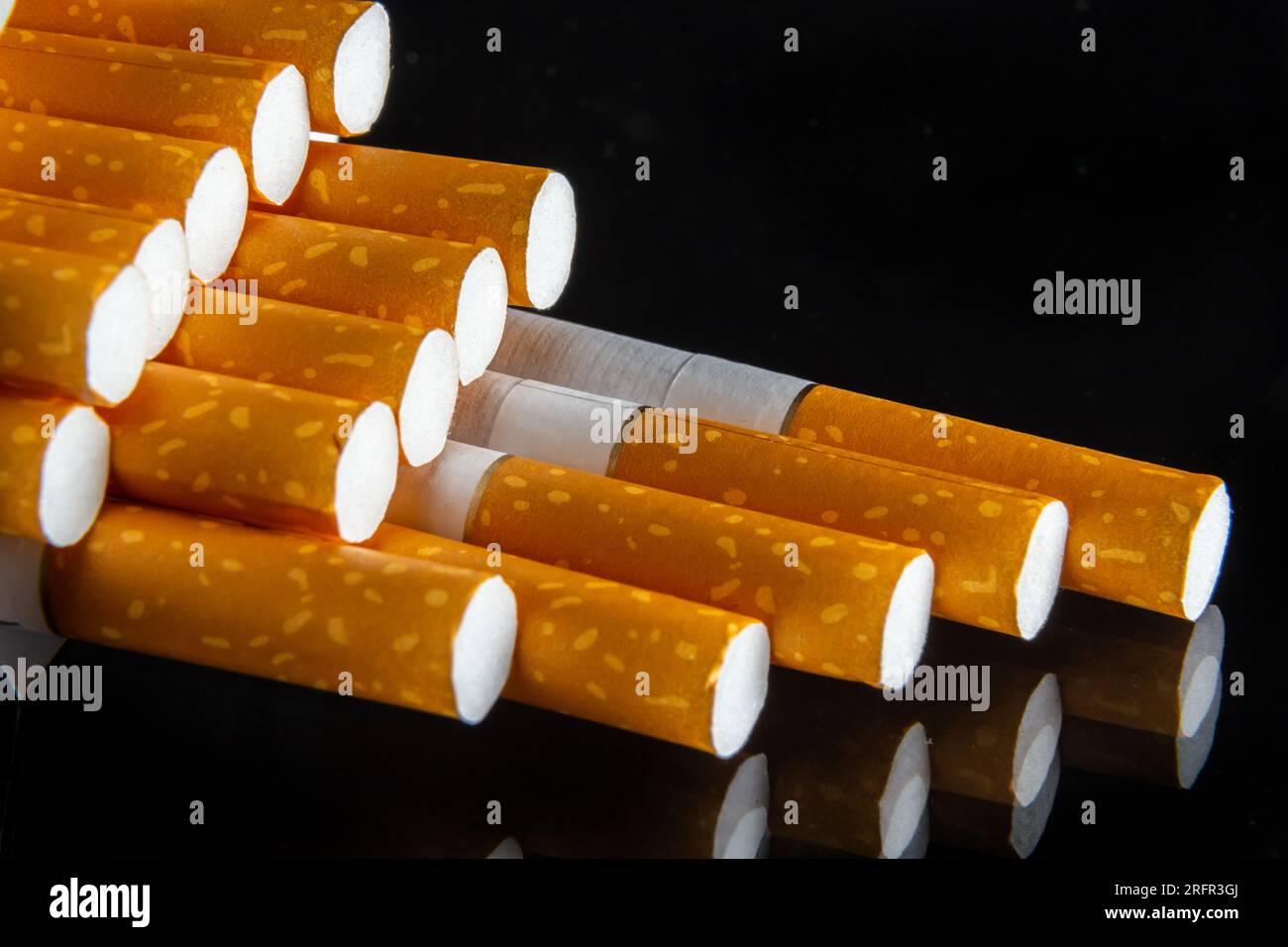 Close up cigarette in pack is addictive to be cancer.smoking reduction ...