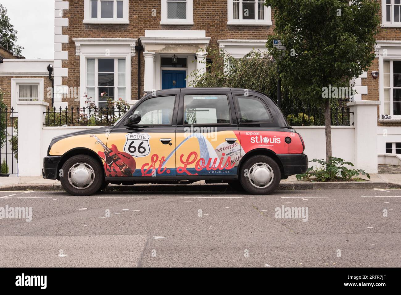 A colourful Route 66, St Louis black cab parked in a side street in ...