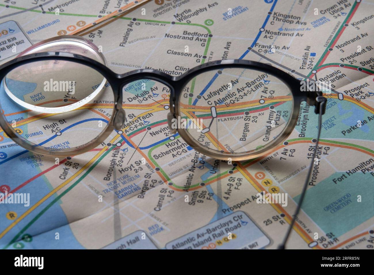 Still life of concept of broken eyeglasses on a subway map, 2023, New ...