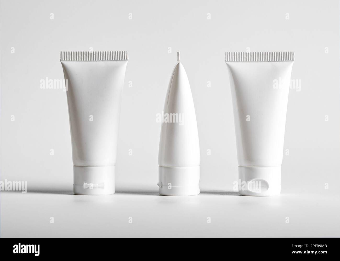 Cream tubes, front, back and side views. Cosmetic containers mockups ...