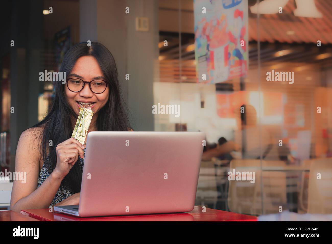 Close up young happy woman biting chocolate bar. People lifestyle food ...