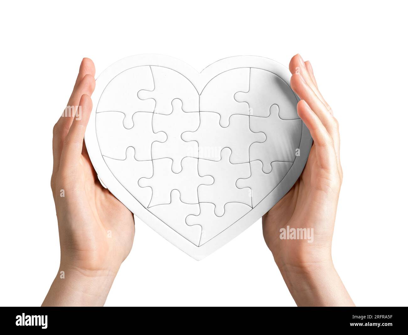 Heart-shaped puzzle in hands isolated on white Stock Photo - Alamy