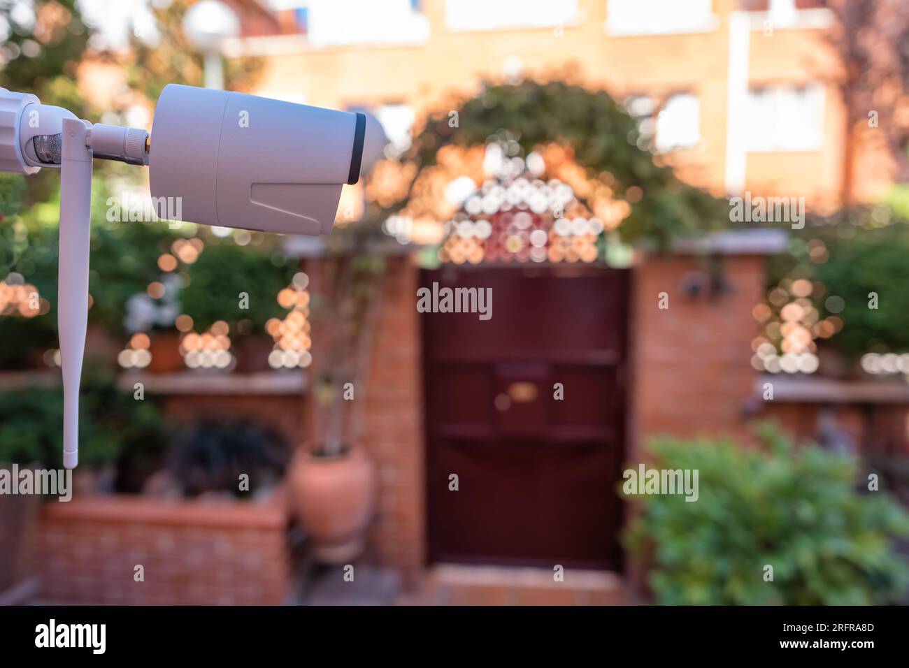 Security camera installed in the garden of a house for the surveillance ...