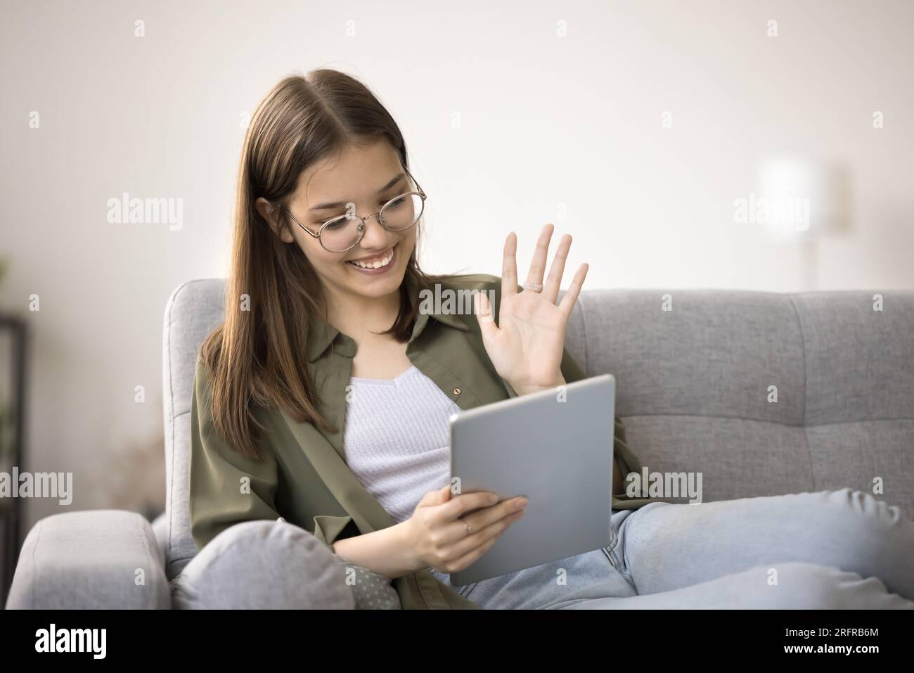 Happy pretty teenager girl in stylish eyeglasses saying hello Stock ...